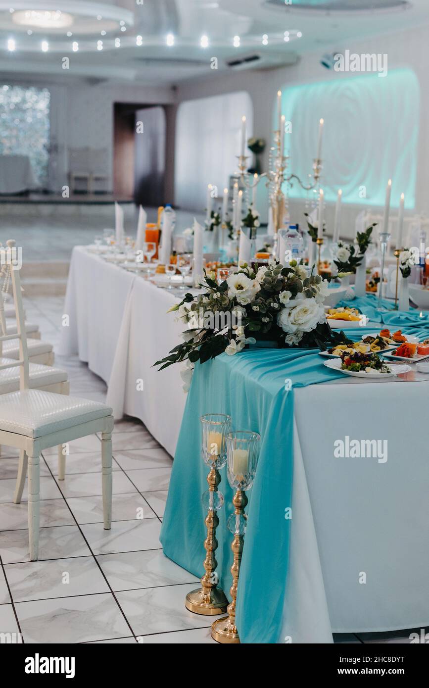 Wedding Banquet hall decorated with flowers. Table setting at a luxury ...