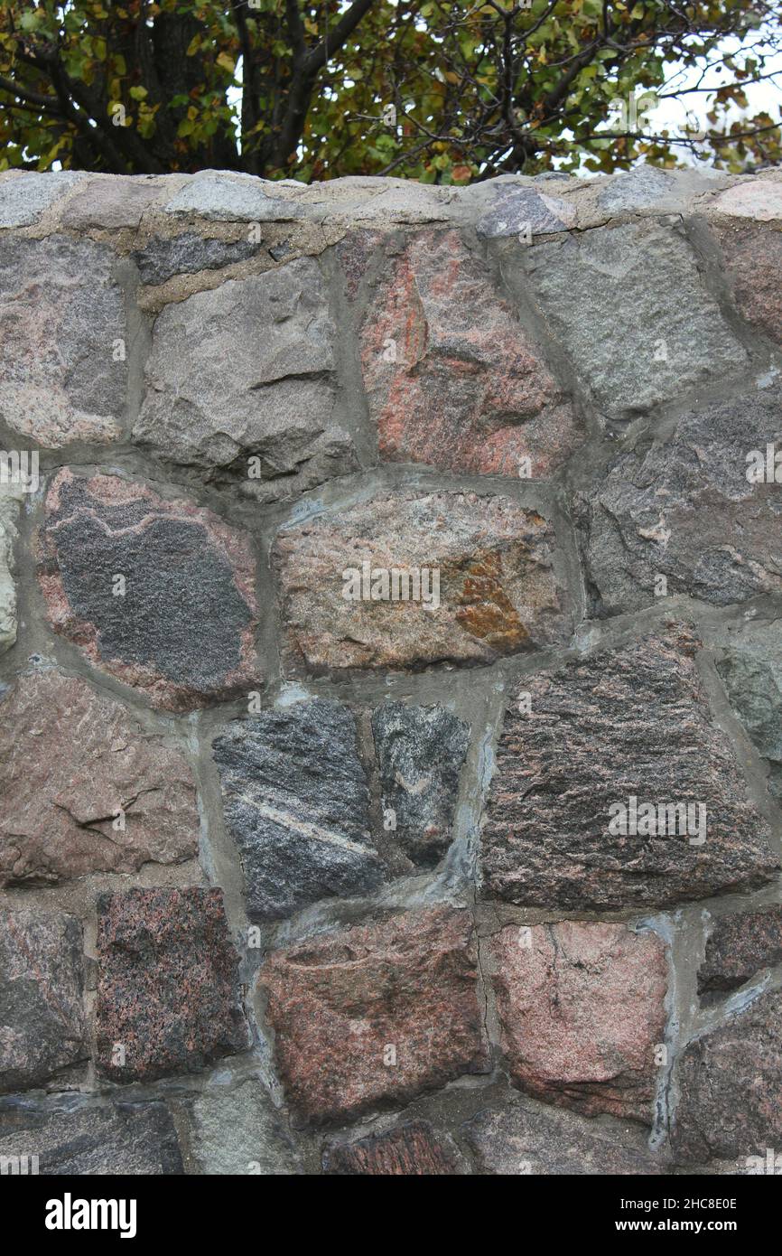 Old stone wall built from huge granite boulders, stones, and rocks ...