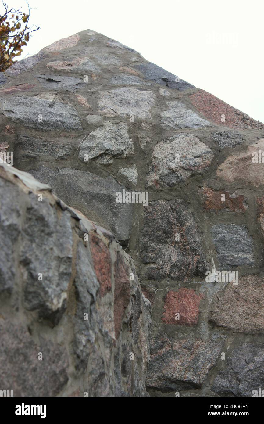 Old stone wall built from huge granite boulders, stones, and rocks ...