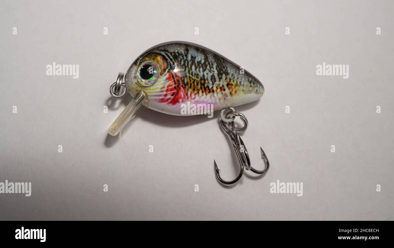Closeup of bait for fishing in the shape of a mini wobbler with a hook ...