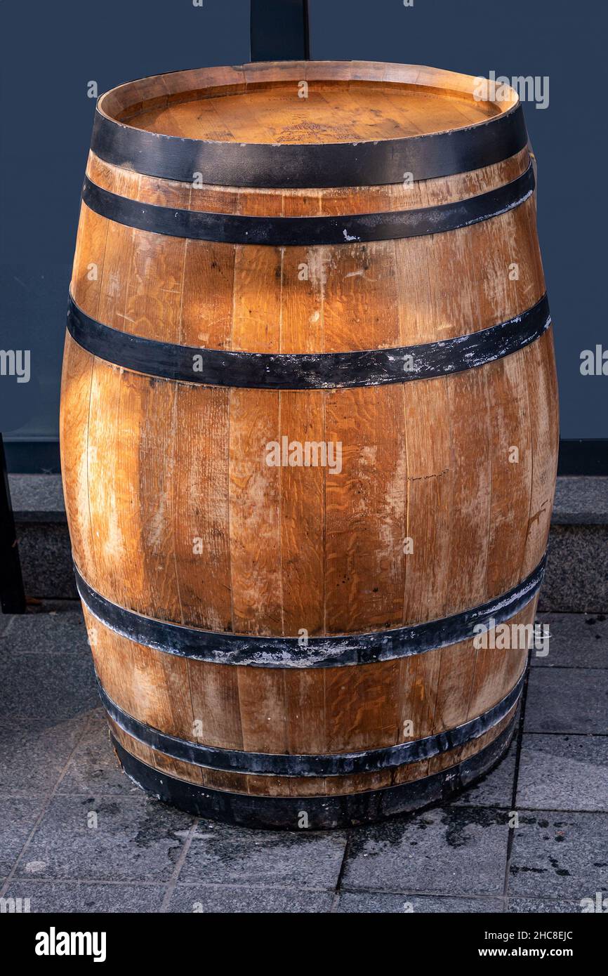 Old retro wooden barrel outside on street pavement Stock Photo - Alamy