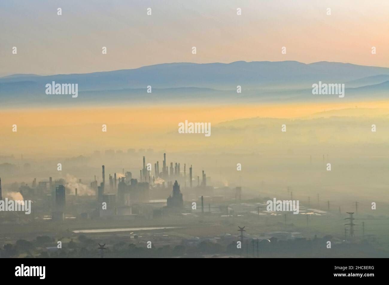 Petrochemical factory and Oil Refinery in smoke and smog. The Inversion ...