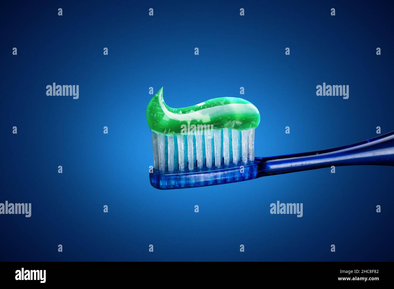 Toothpaste on a brush. Green toothpaste with crystals. Brush and ...