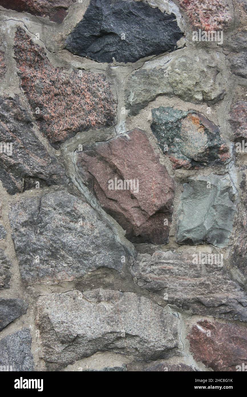 Old stone wall built from huge granite boulders, stones, and rocks ...