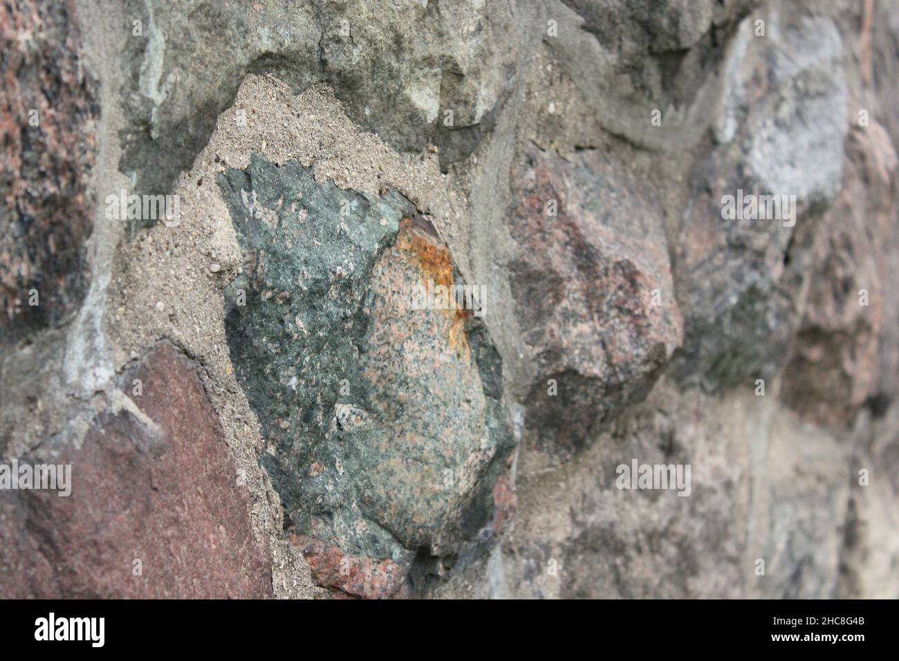 Old stone wall built from huge granite boulders, stones, and rocks ...