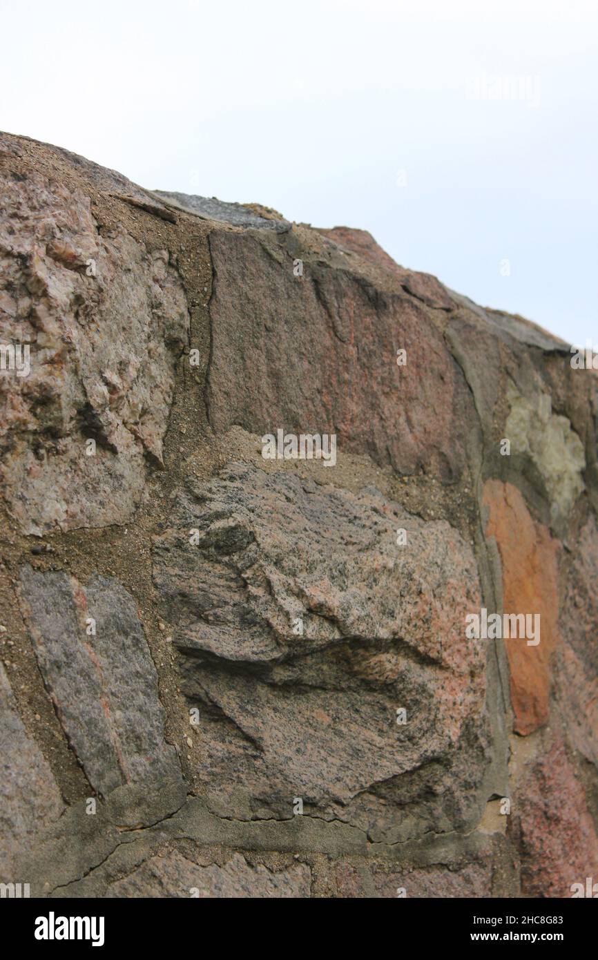 Old stone wall built from huge granite boulders, stones, and rocks ...