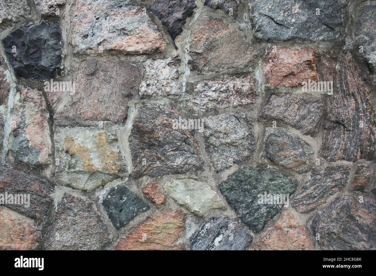 Old stone wall built from huge granite boulders, stones, and rocks ...