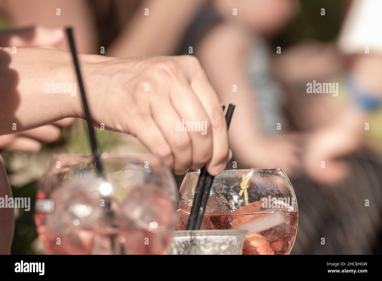 hand shaking a red drink Stock Photo - Alamy