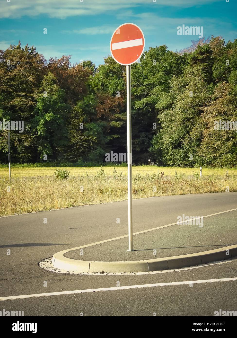 Vertical shot of a route with a prohibiting sign Stock Photo - Alamy