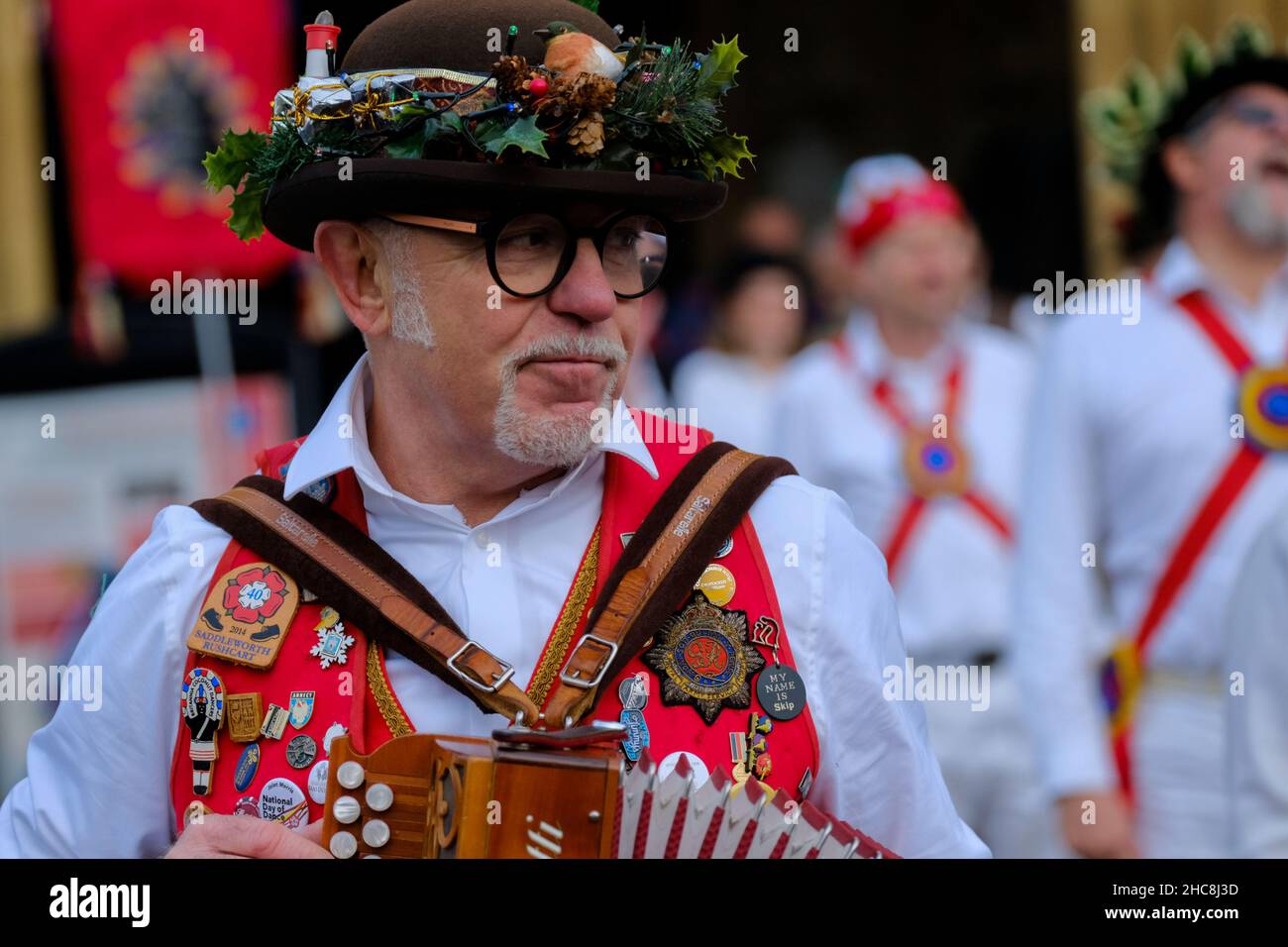 Gloucester, UK. 26th Dec, 2021. Morris Men and Mummers perform in front ...