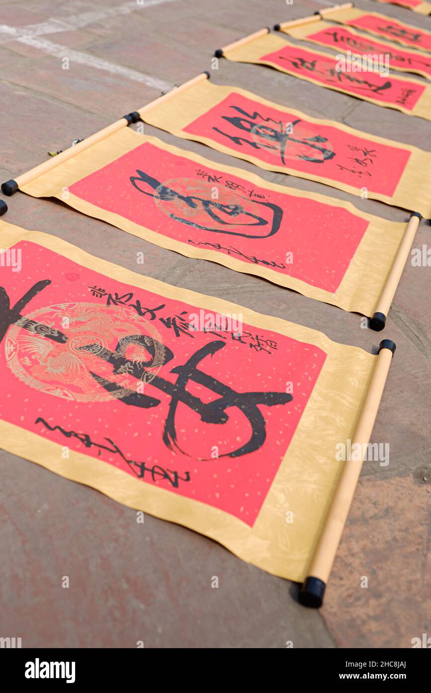 Closeup shot of Vietnamese calligraphy on banners in temple, painted on ...