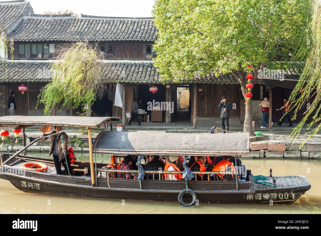 Boat loaded with tourists on excursion on the canals of the water ...