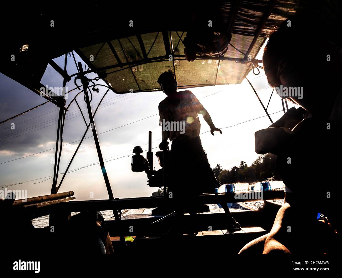 Silhouette of a passenger boat driver in the daytime backlit Stock ...