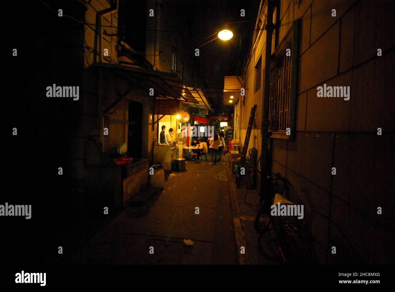 Food shop in a small alley Dark and mysterious Stock Photo - Alamy