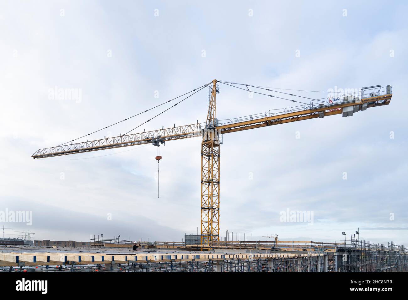 Construction site with tower crane for lifting building materials and ...