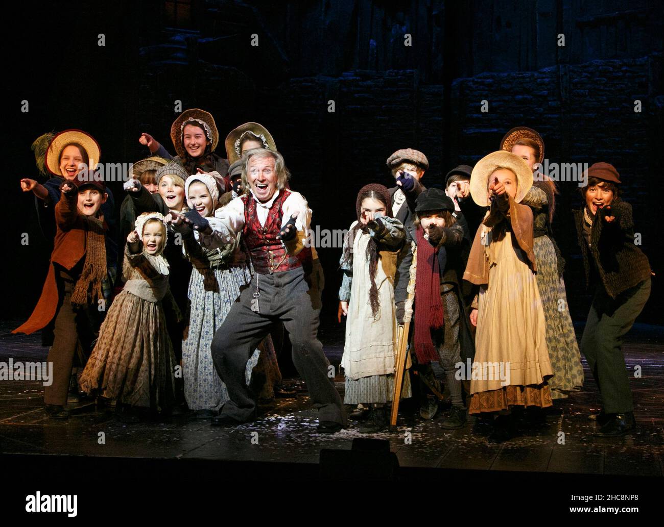 Tommy Steele (Ebenezer Scrooge) with children in SCROOGE at the London ...
