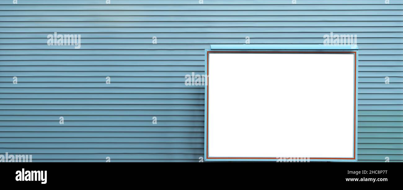 Empty indoor advertising display board on blue wall Stock Photo - Alamy