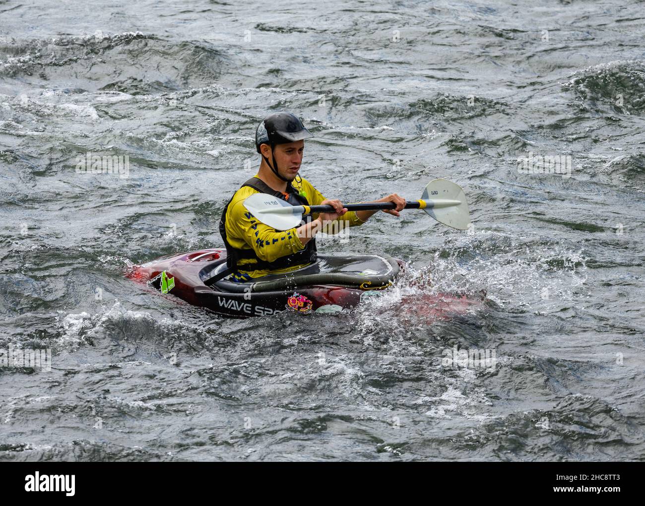A man fighting the torrent of Sarapiqui River in a kayak. Heredia ...
