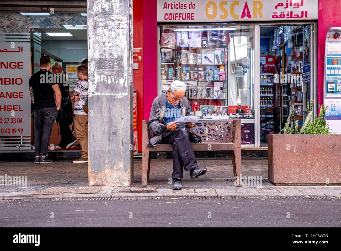 Man reading newspaper while sitting hi-res stock photography and images ...