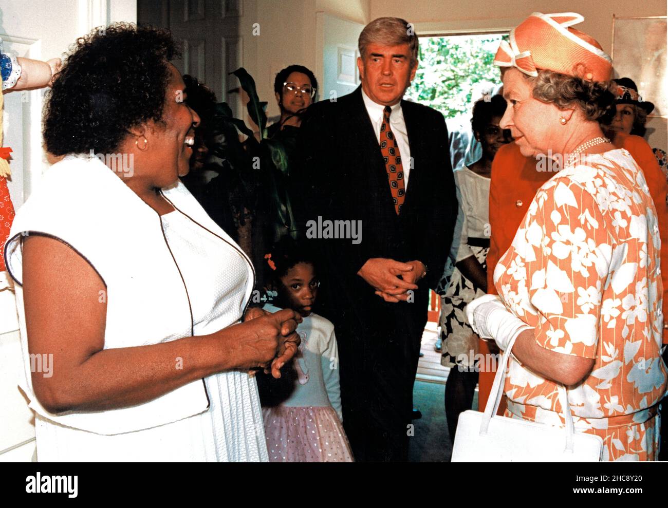 Mrs. Alice Frazier, left, greets Queen Elizabeth II of Great Britain ...