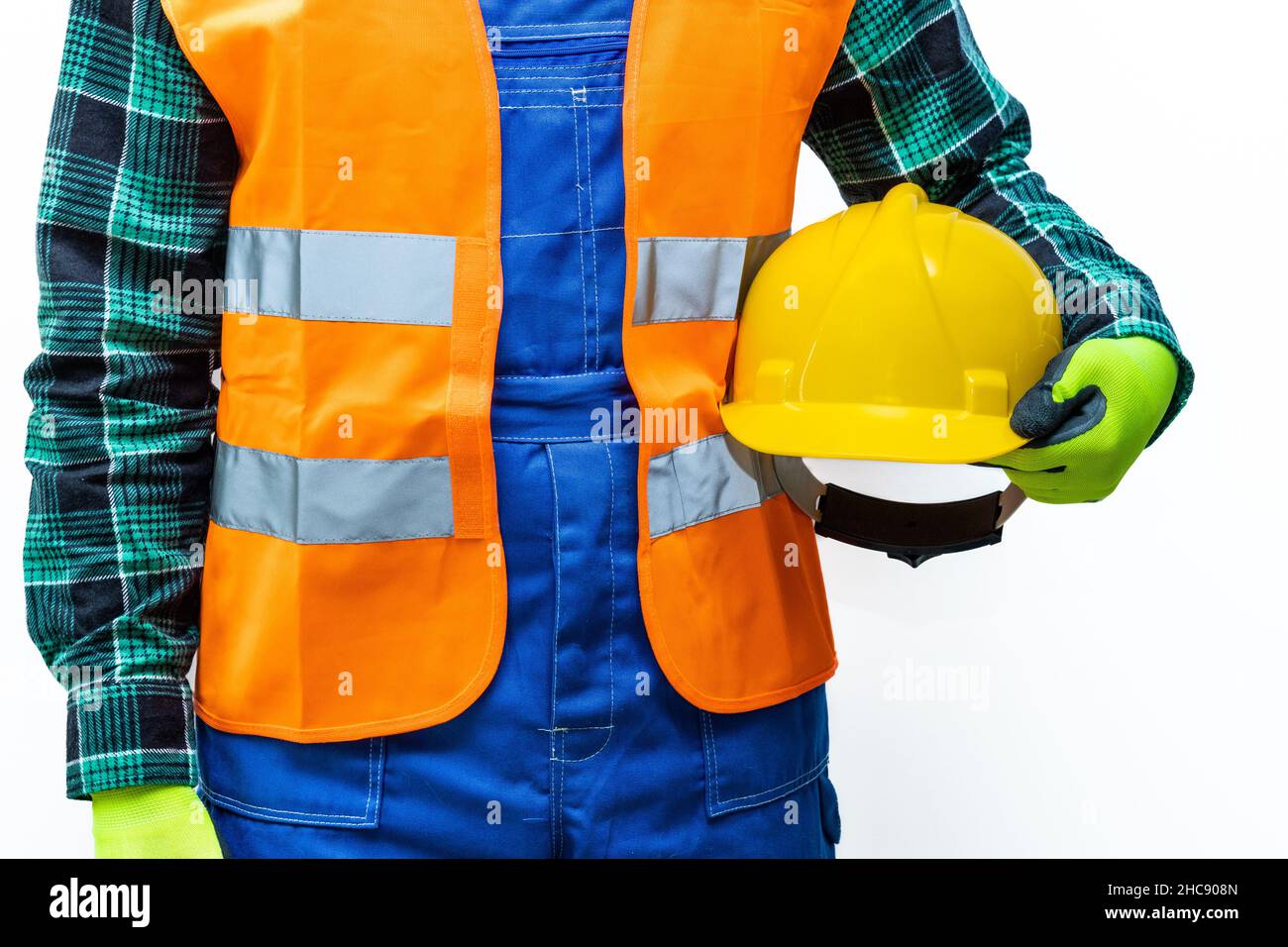 Construction or road worker wearing a high-visibility vest with a ...