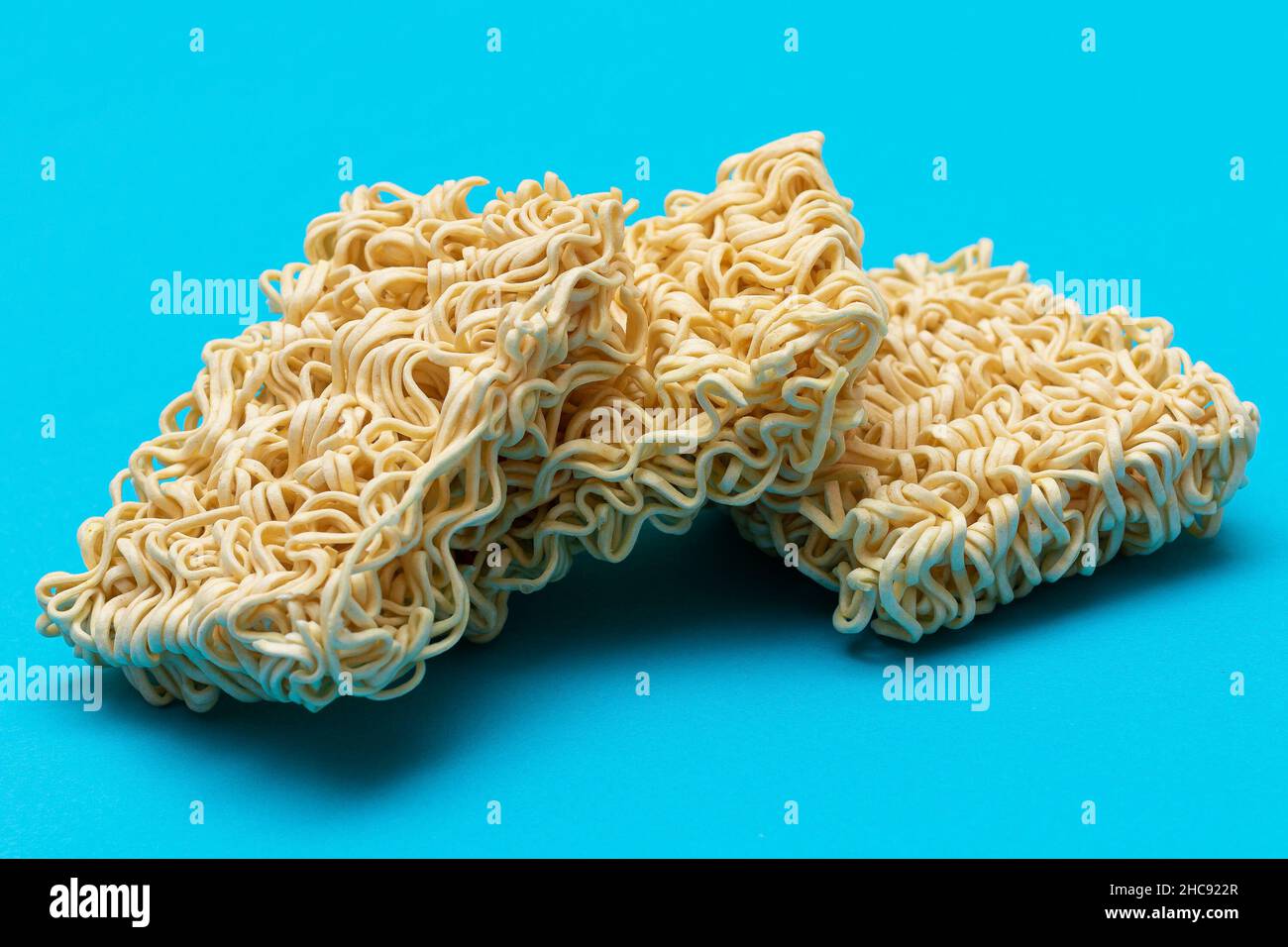 Uncooked Instant Noodles on Blue Background. Raw Pasta. Dry Asian Fast ...