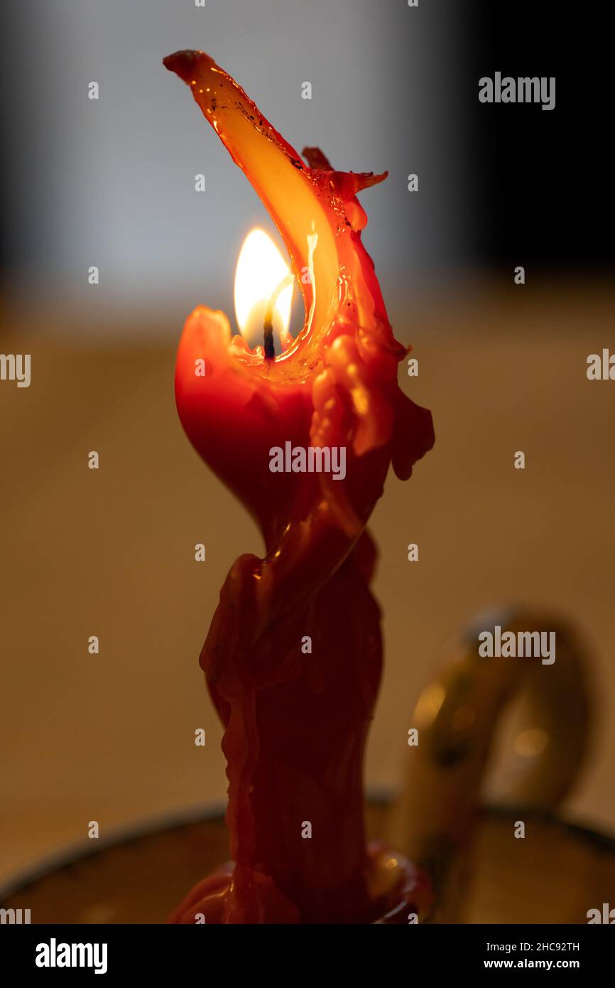 macro photograph of a red wax candle consumed by its hot flame Stock ...