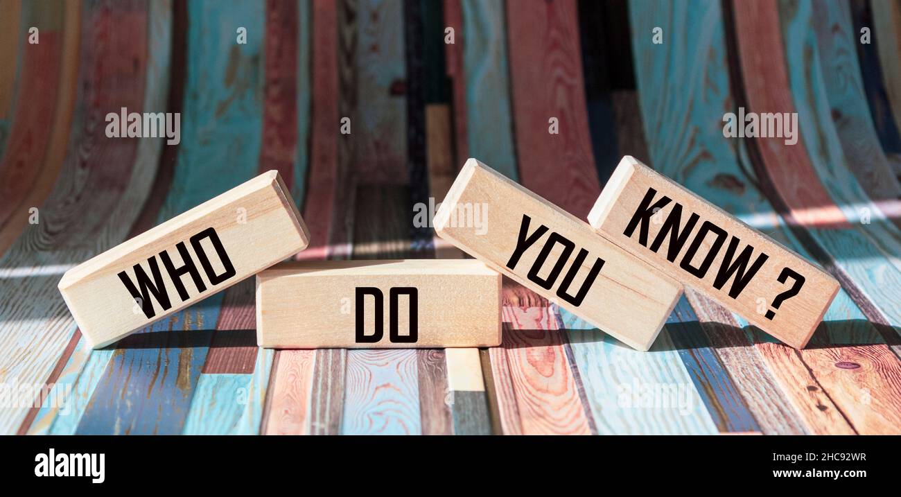 Who do you know symbol. Wooden blocks with the inscription who you know ...