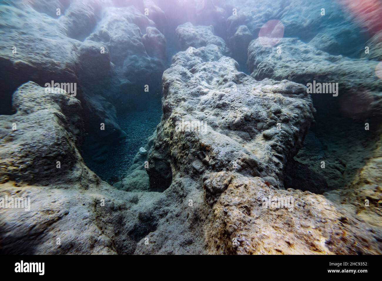 A deserted but fascinating underwater landscape with large rocks ...