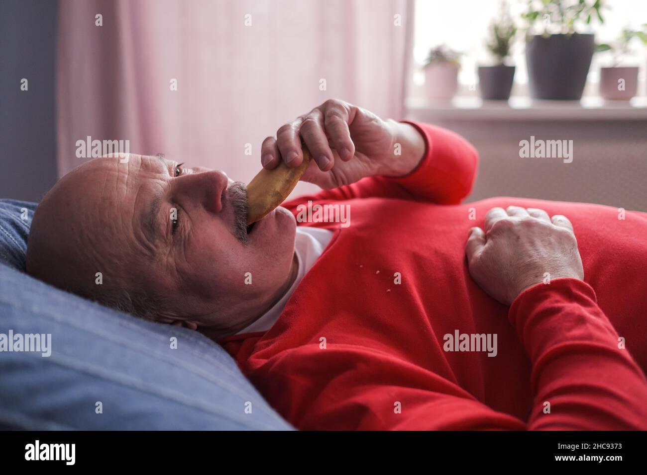 Obese man eating cake hi-res stock photography and images - Alamy