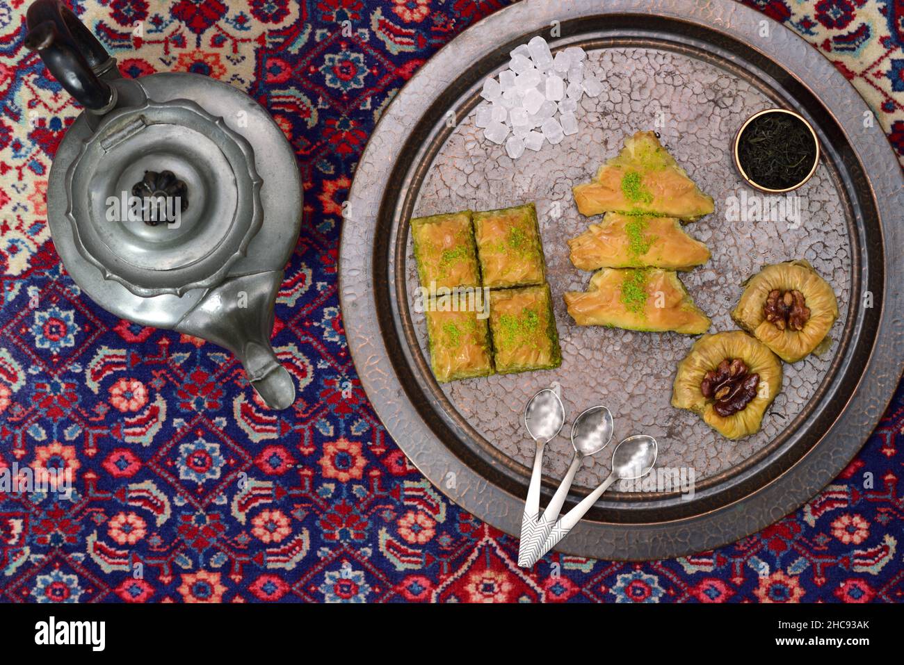 Fresh baklava, oriental pastry made from puff pastry and nuts, lies on ...
