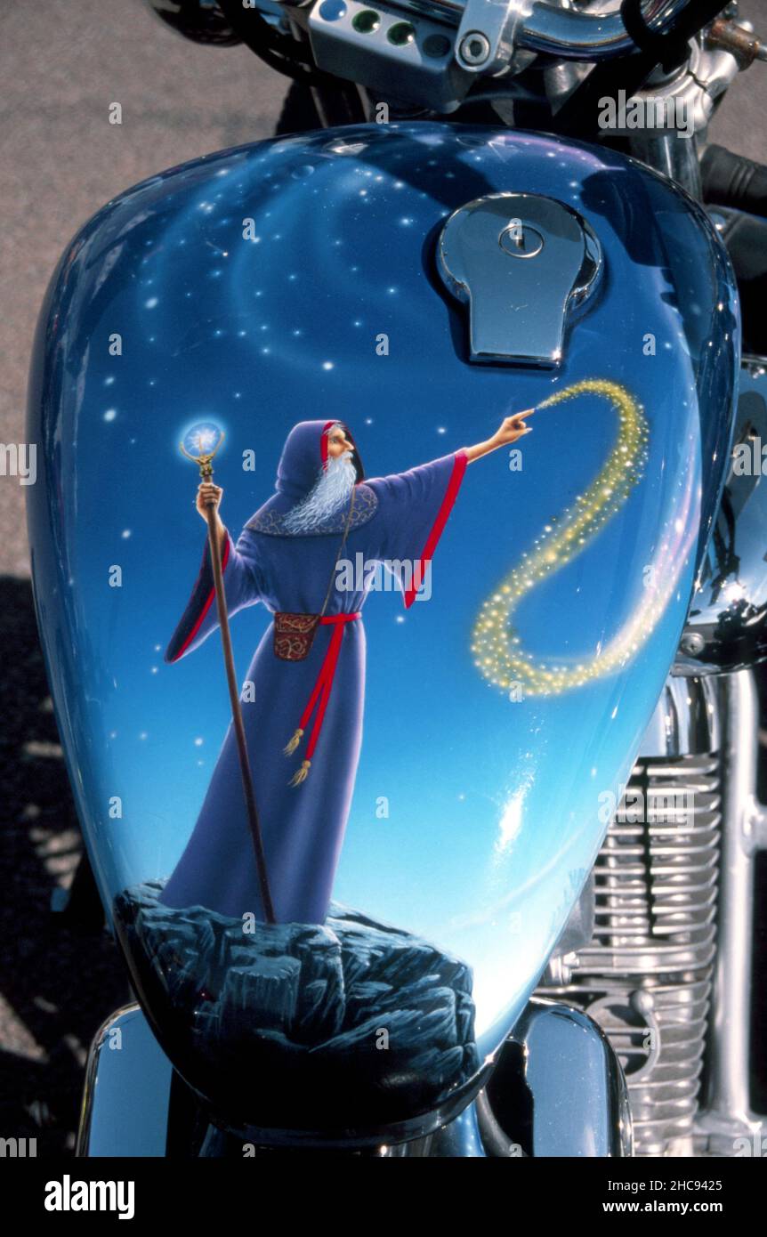 Motorcycle tank art of wizard holding staff with a blue orb on top and ...