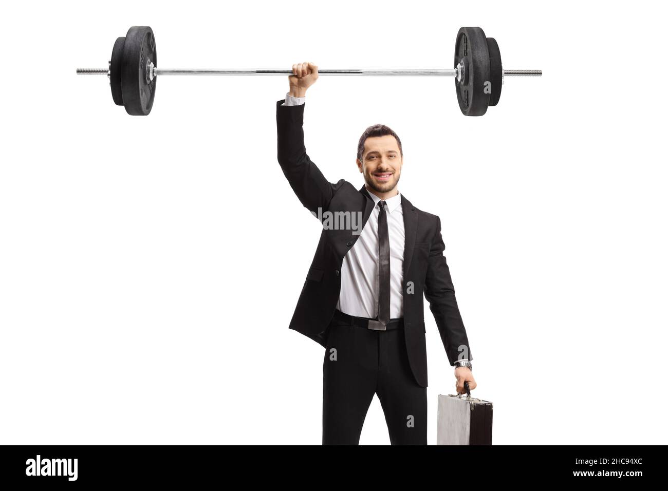 Young businessman lifting weights with one hand isolated on white ...