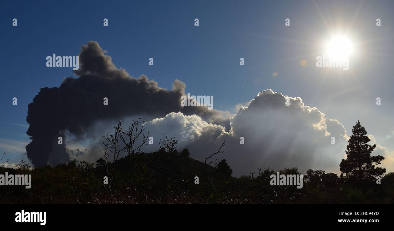 Landscape with clouds of smoke and steam from volcanic eruption, blue ...