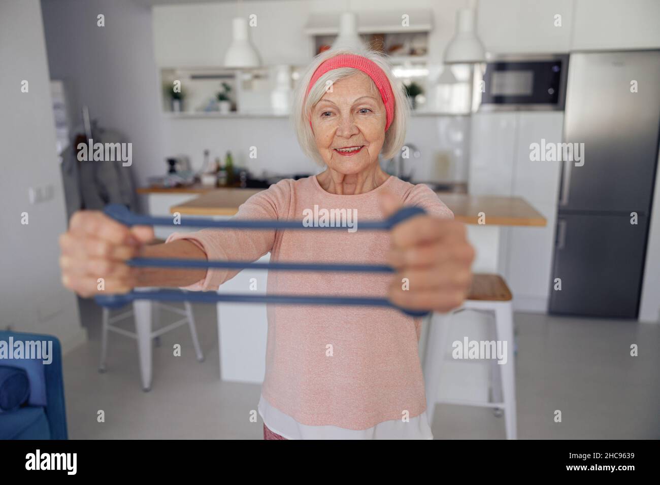 Elderly lady doing fitness workout at home Stock Photo - Alamy