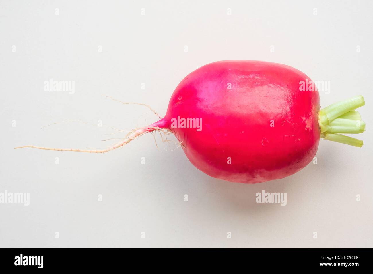 Red big radish on a light background, not isolated Stock Photo - Alamy