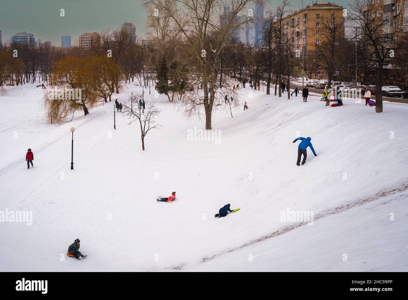 MOSCOW, RUSSIA - December 26, 2021: Sledding tubes and slides on Sunday ...