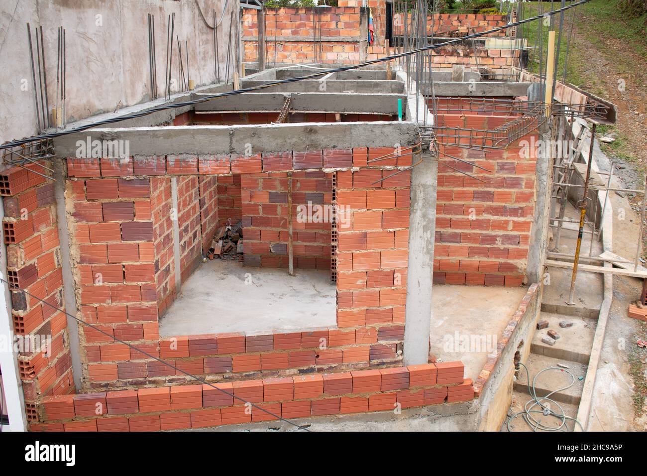 House under construction with its columns and walls recently built ...
