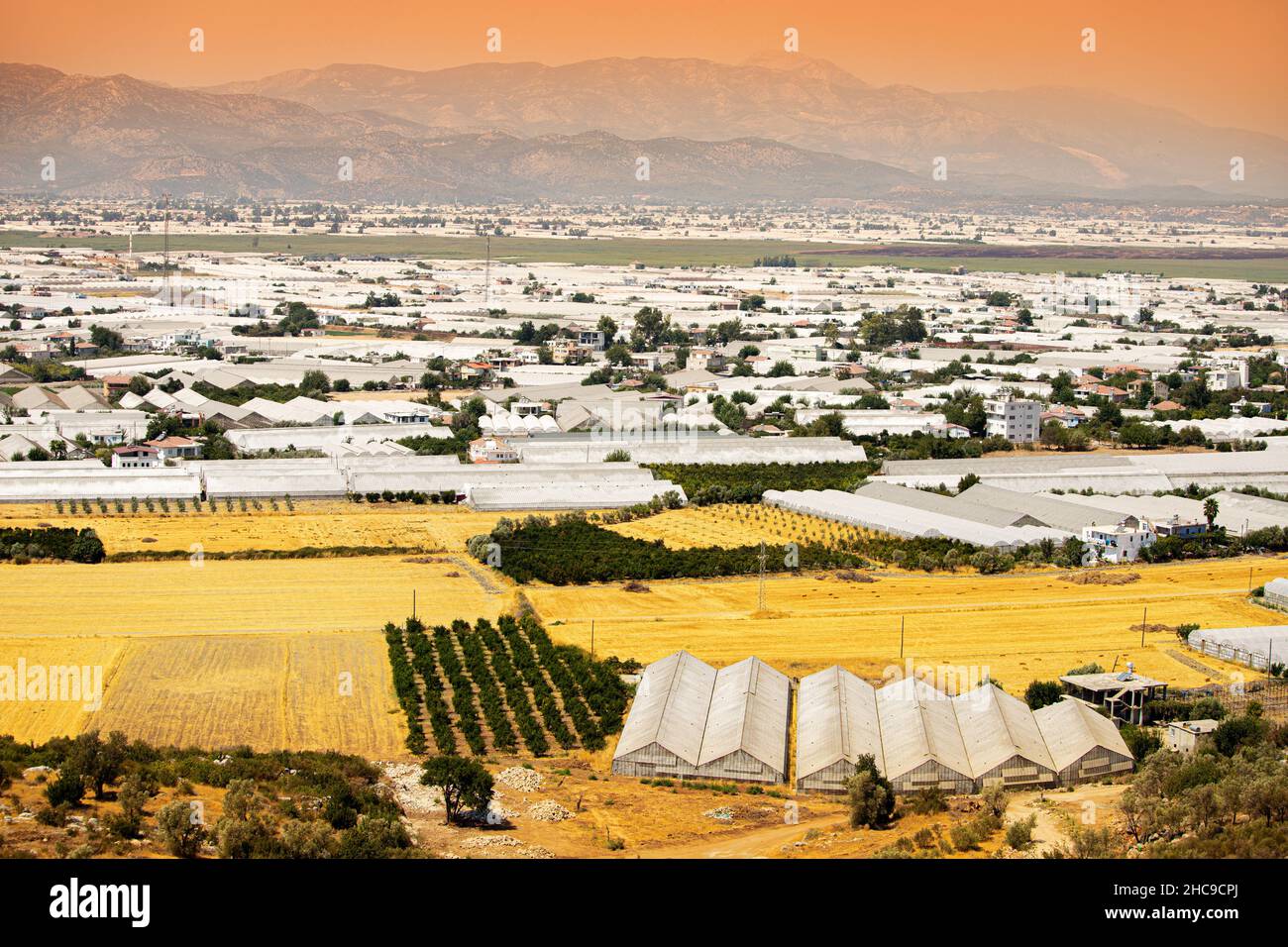 Aerial view of various greenhouses and agricultural fields in ...