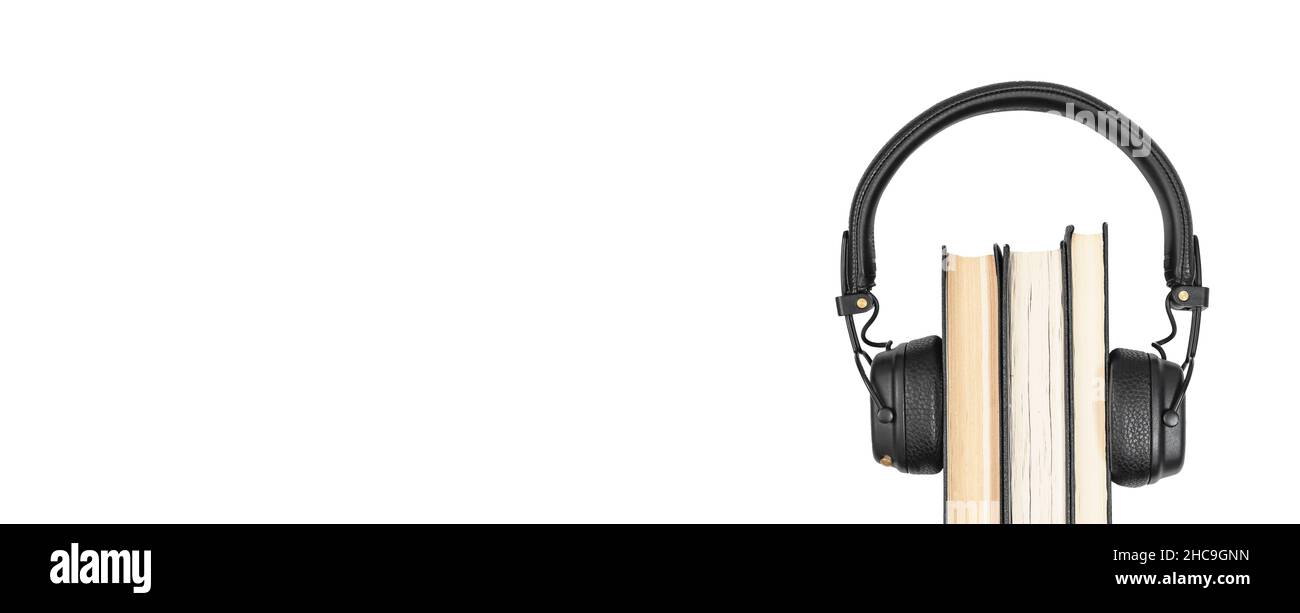 Audio books concept. Classic paper literature stack with headphones ...