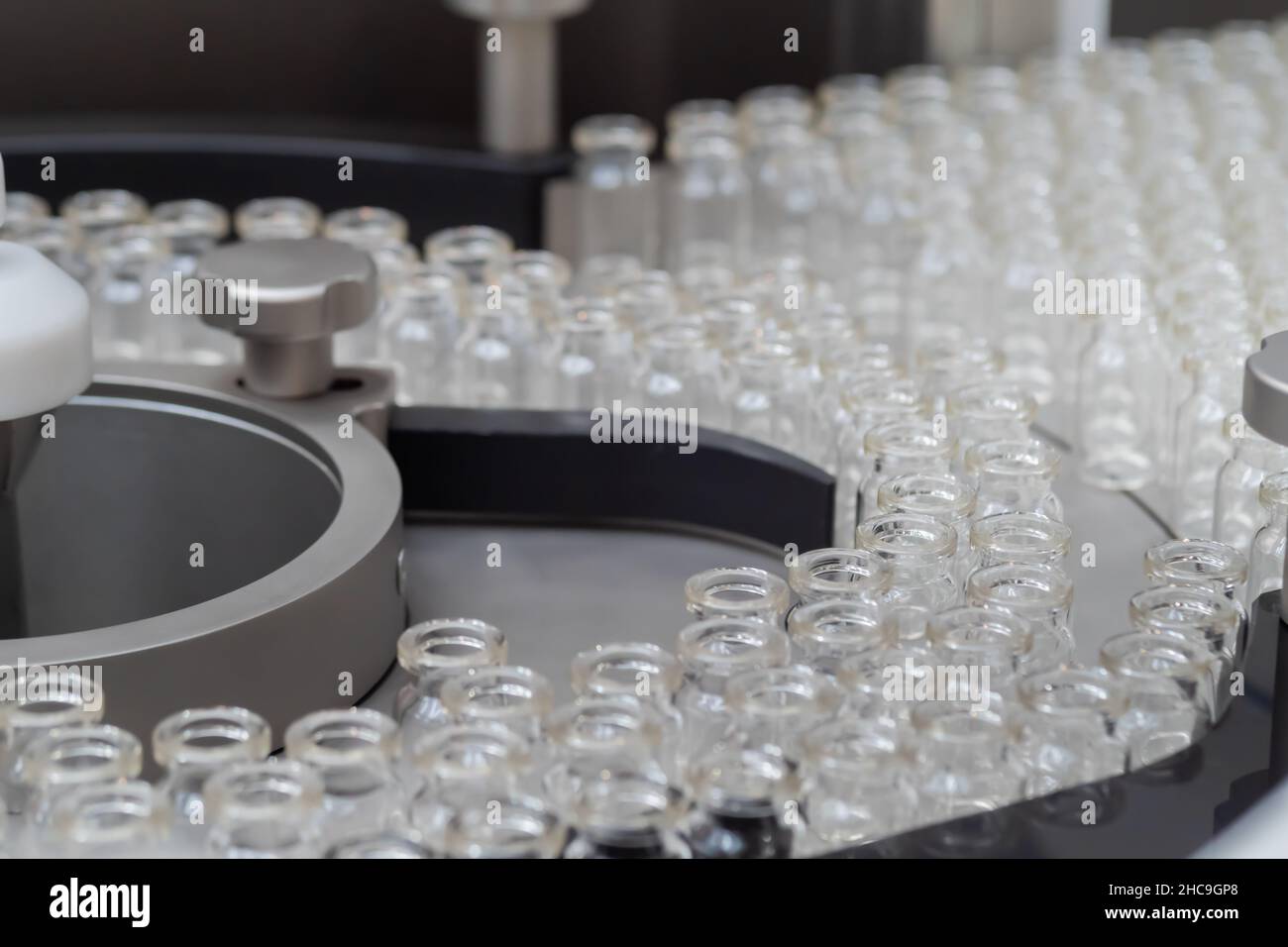 Conveyor belt with empty medical injection glass vials - production ...