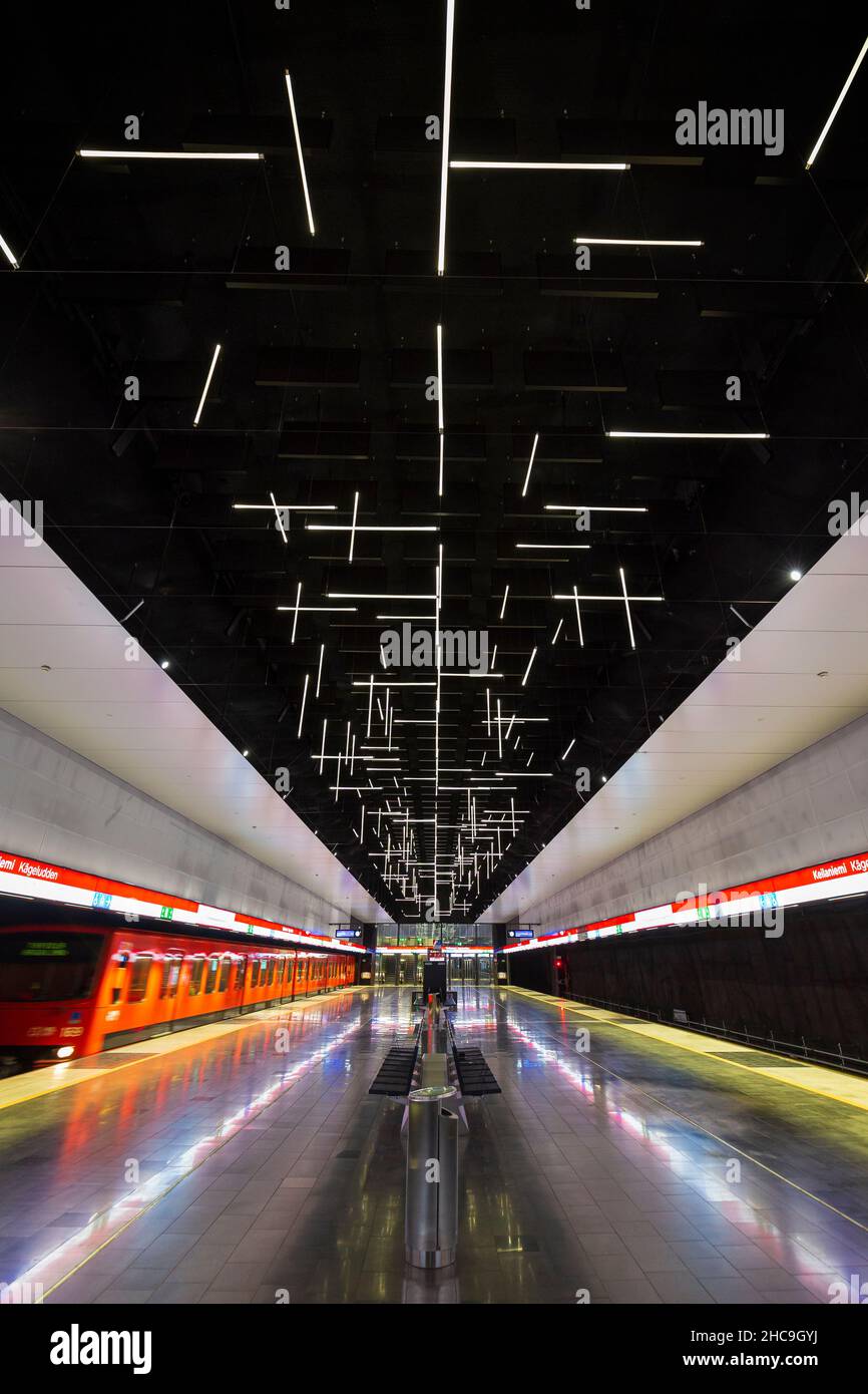 Subway train at one of Helsinki's newer and modern metro stations ...