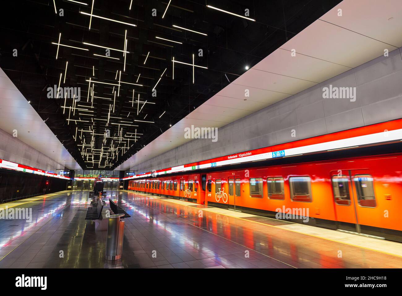 Subway train at one of Helsinki's newer and modern metro stations ...