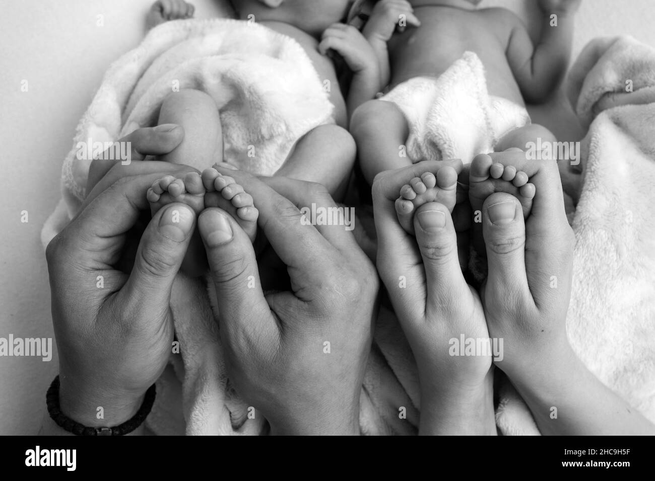 Baby holding legs mother Black and White Stock Photos & Images - Alamy