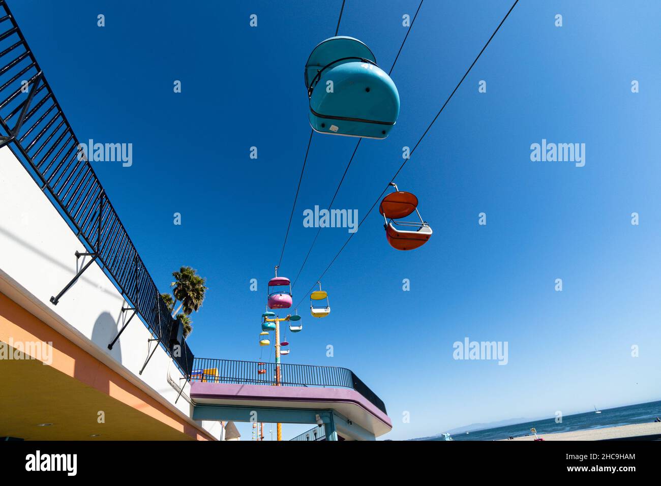 Wide Shot of Cable cars, blue and red in Santa Cruz Beach Boardwalk ...