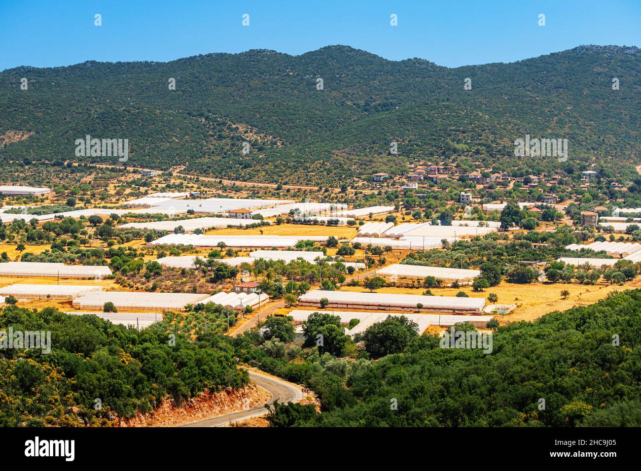 Aerial view of various greenhouses and agricultural fields in ...