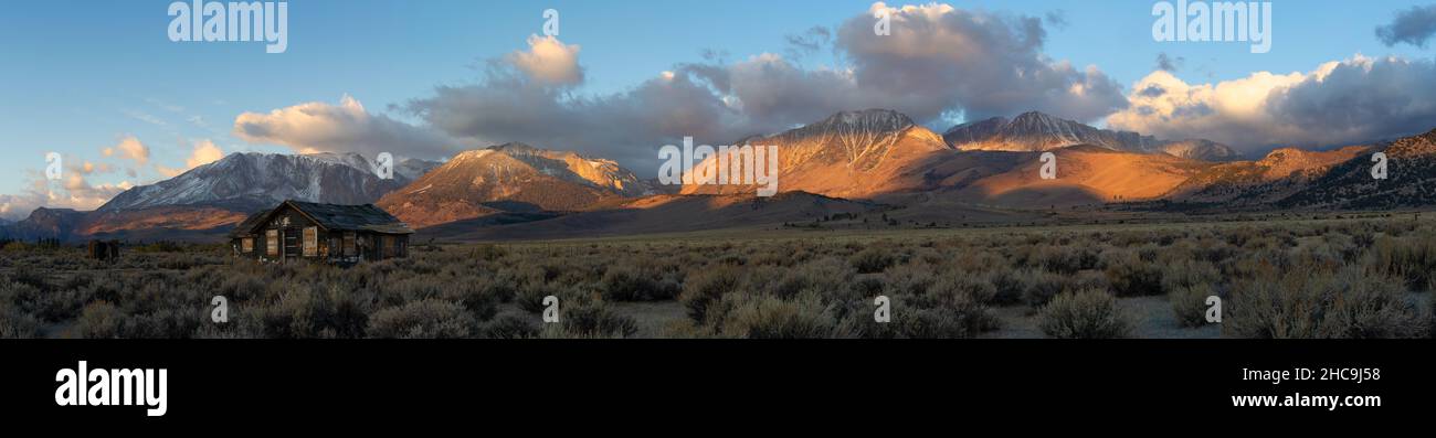 Old abandoned building at sunrise with the Sierra Nevada Mountains in ...