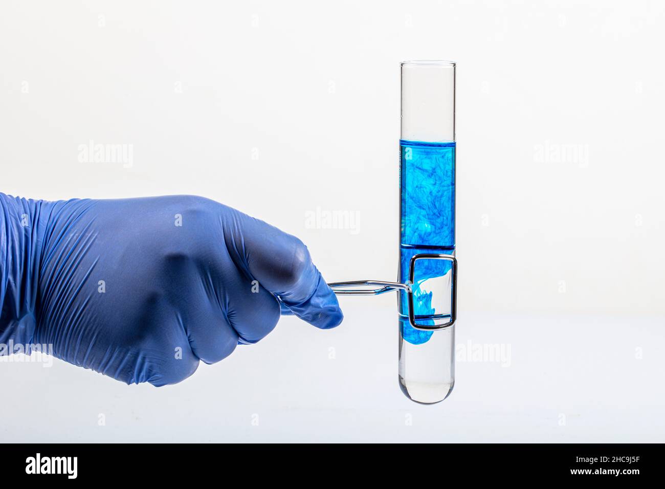 Researchers scientist working analysis with blue liquid test tube in ...