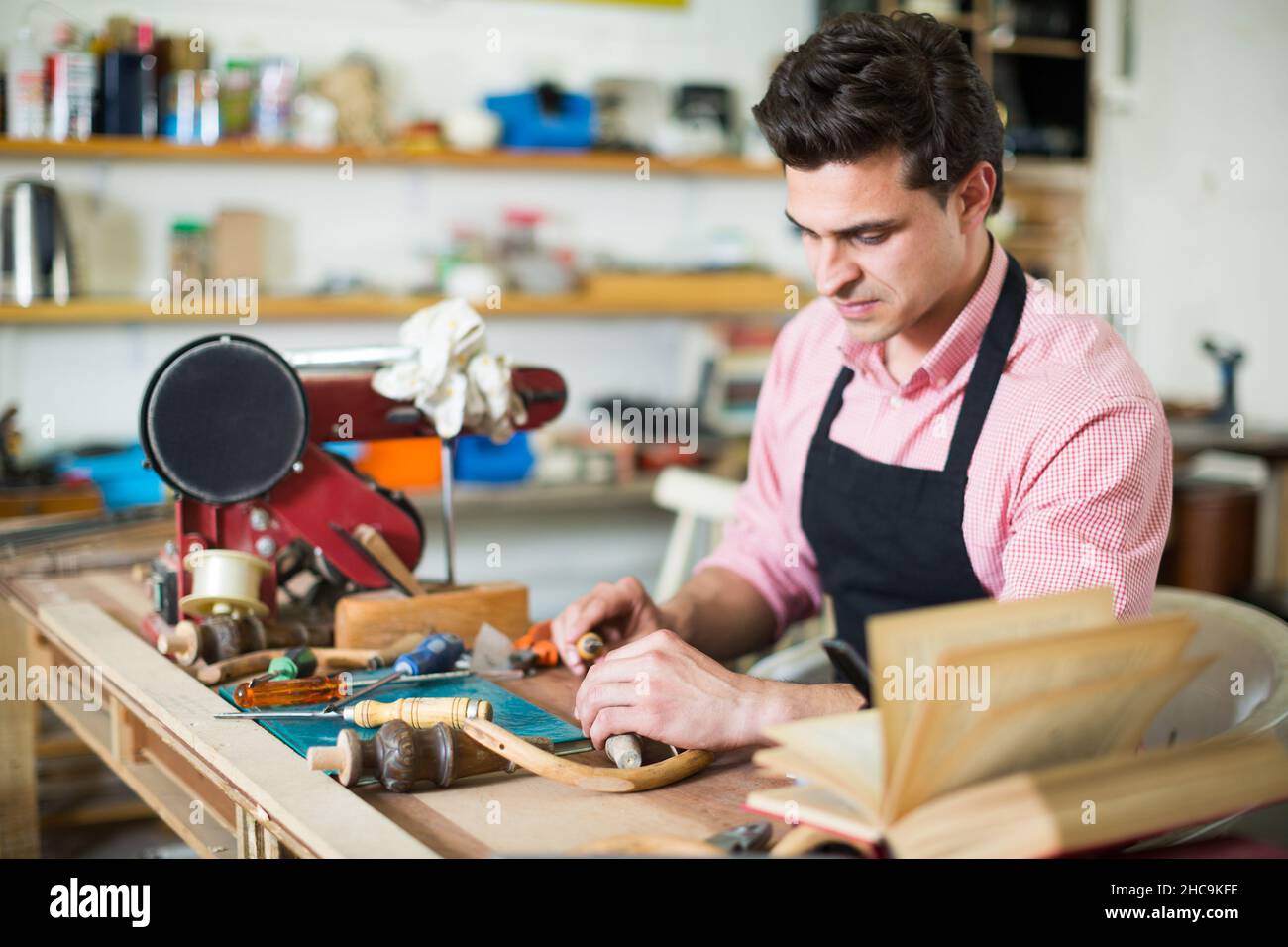 Craftsman in uniform working in carpentry Stock Photo - Alamy