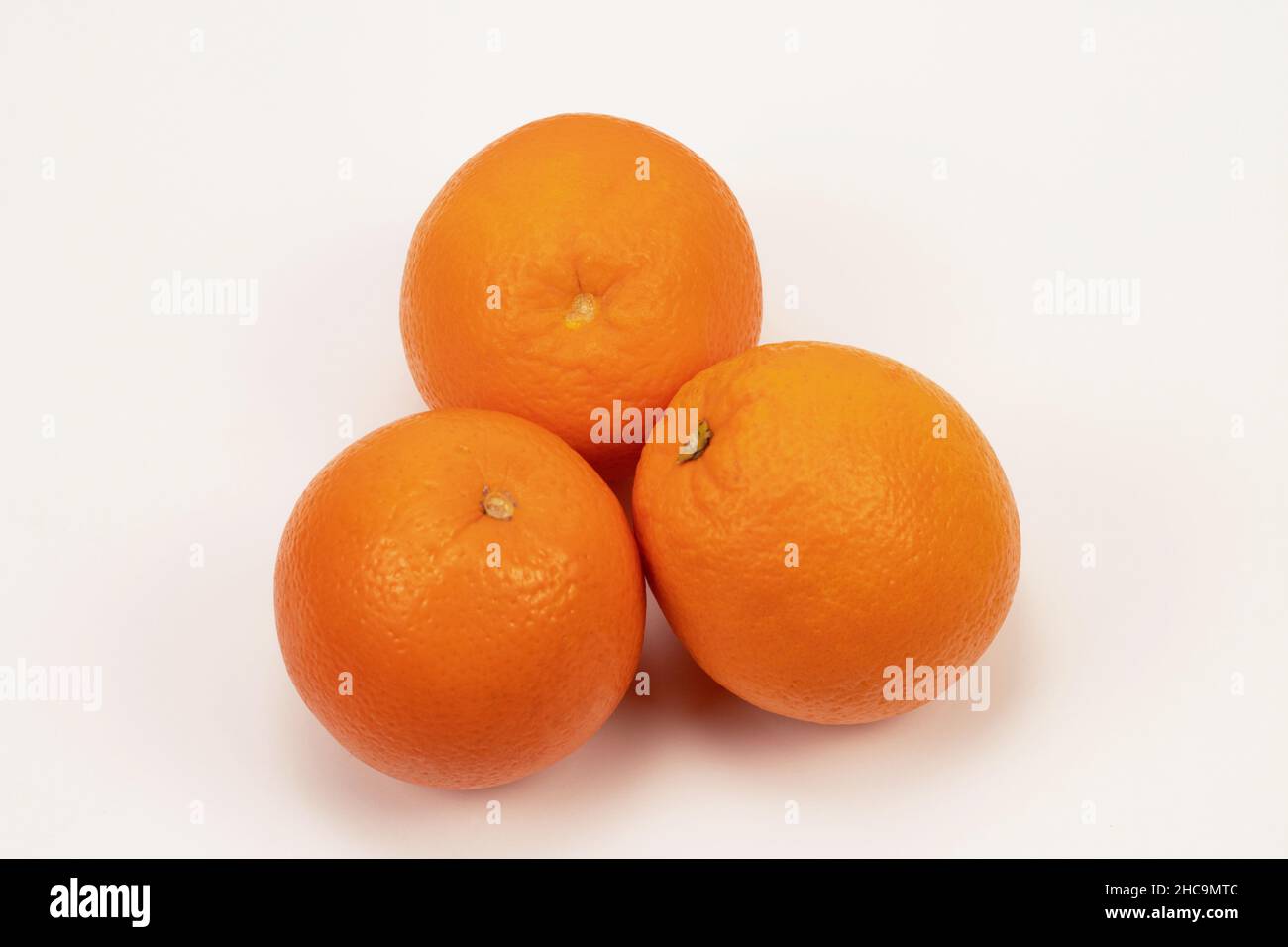 Three Oranges Isolated on a White Background Stock Photo - Alamy